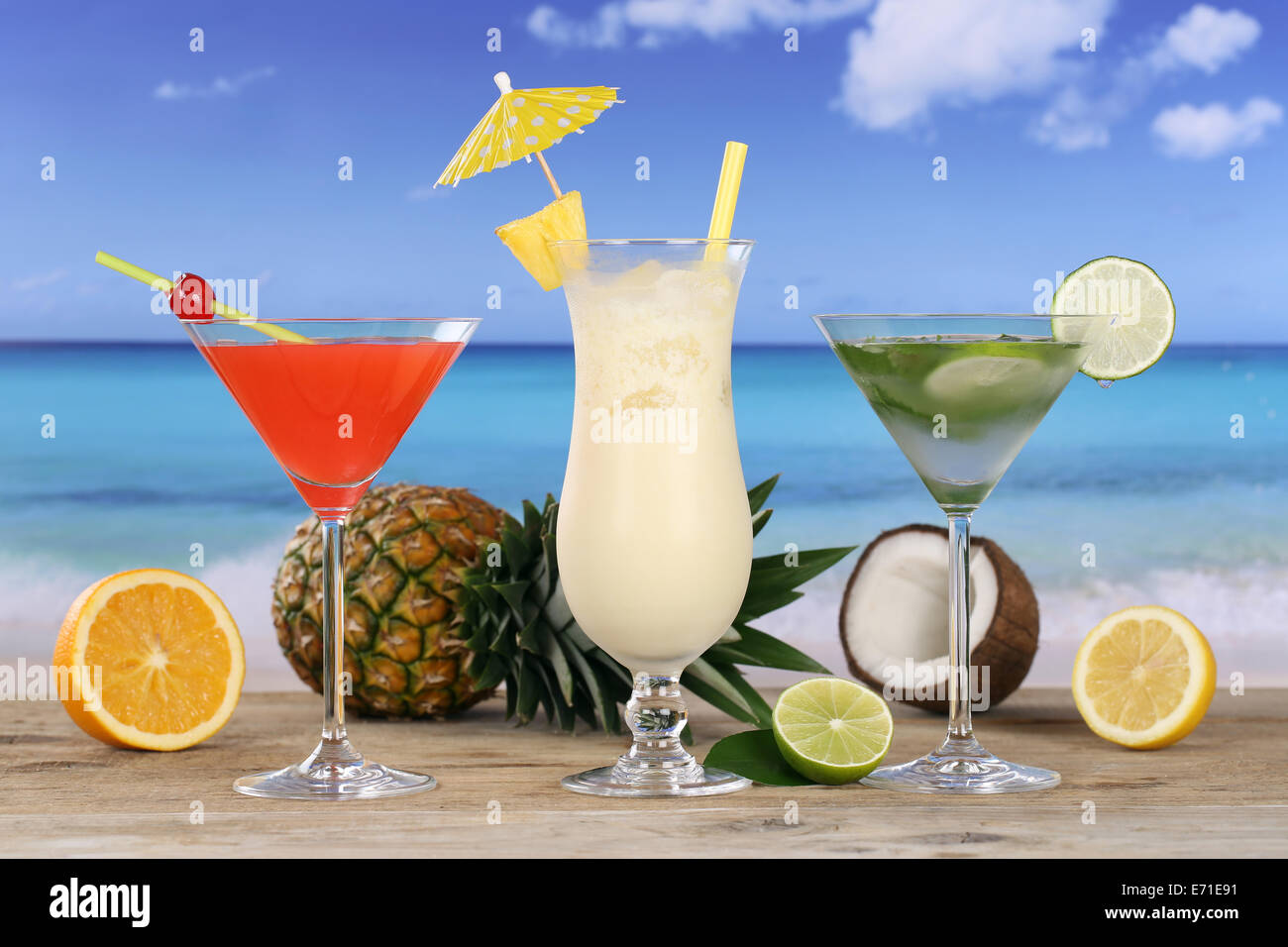 Cocktails and drinks like Pina Colada and Martini on the beach and sea ...