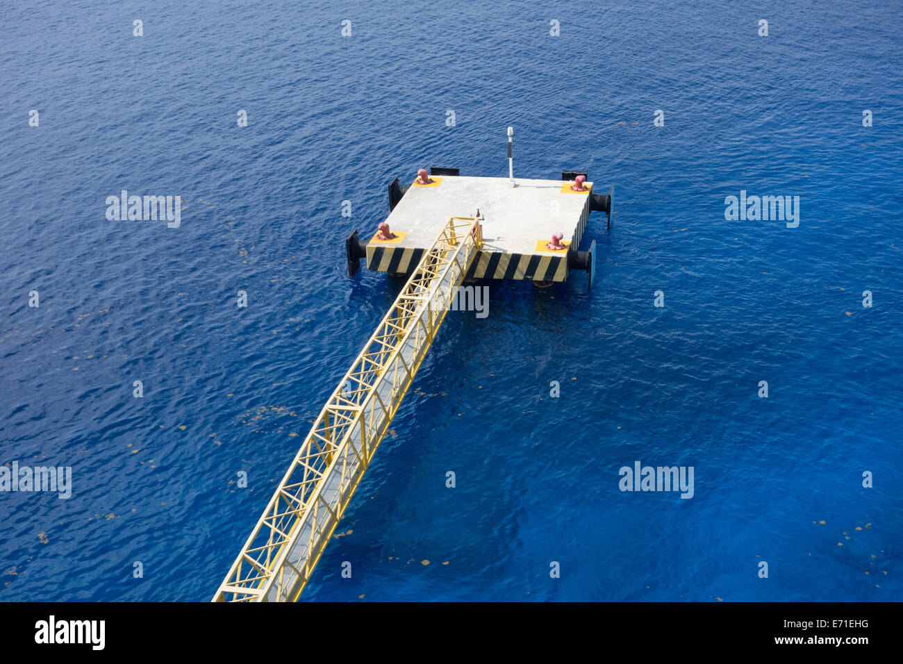Steel walkway bridge over sea to ships docking platform Stock Photo - Alamy