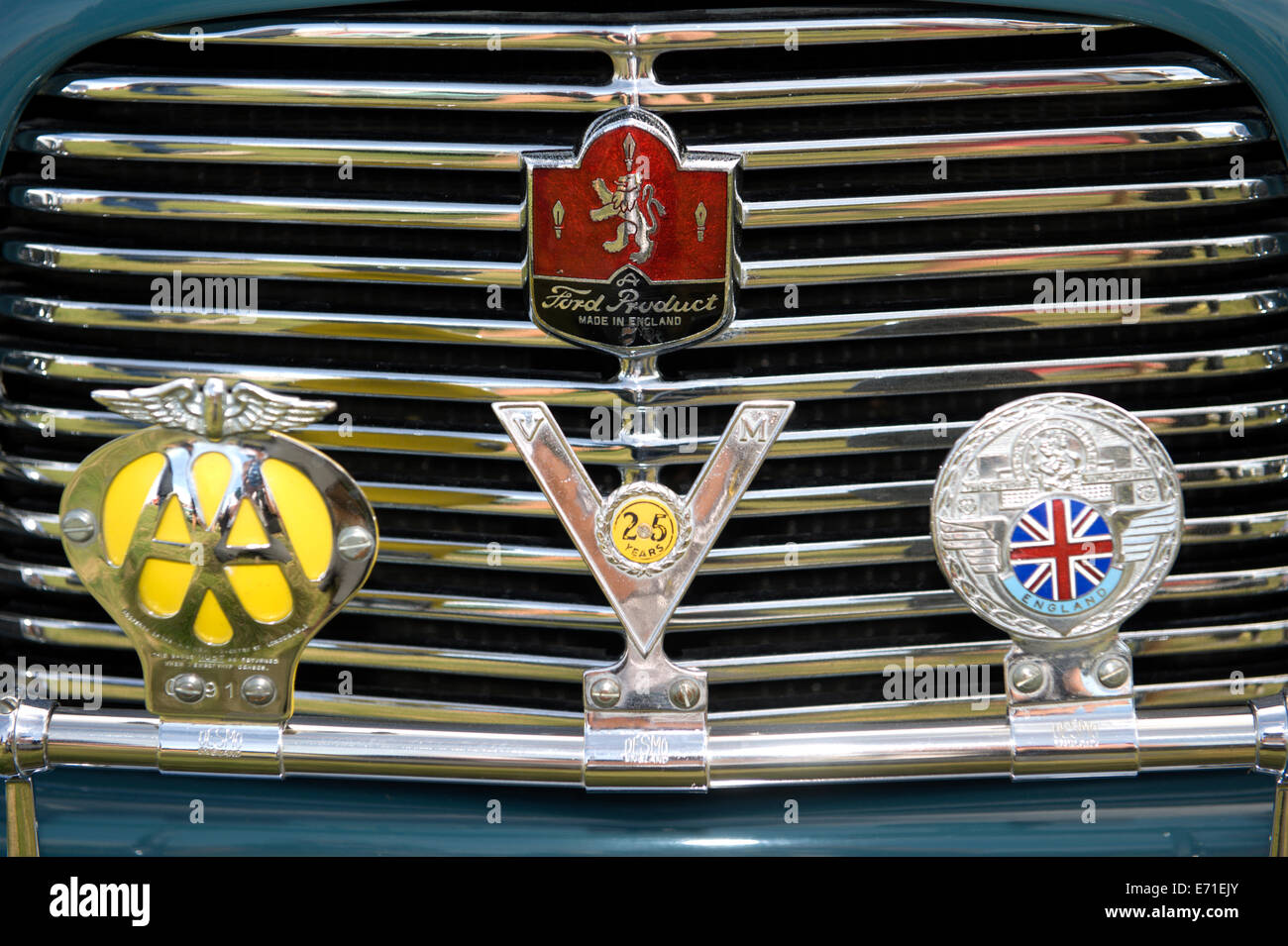 Close up of various badges on a vintage car on display at the ...