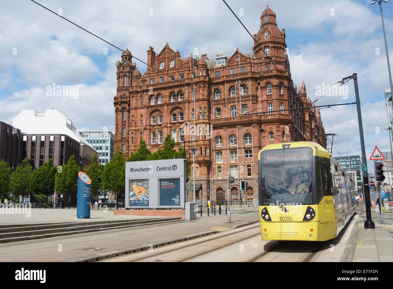 Metrolink tram with Midland hotel in the background in central ...