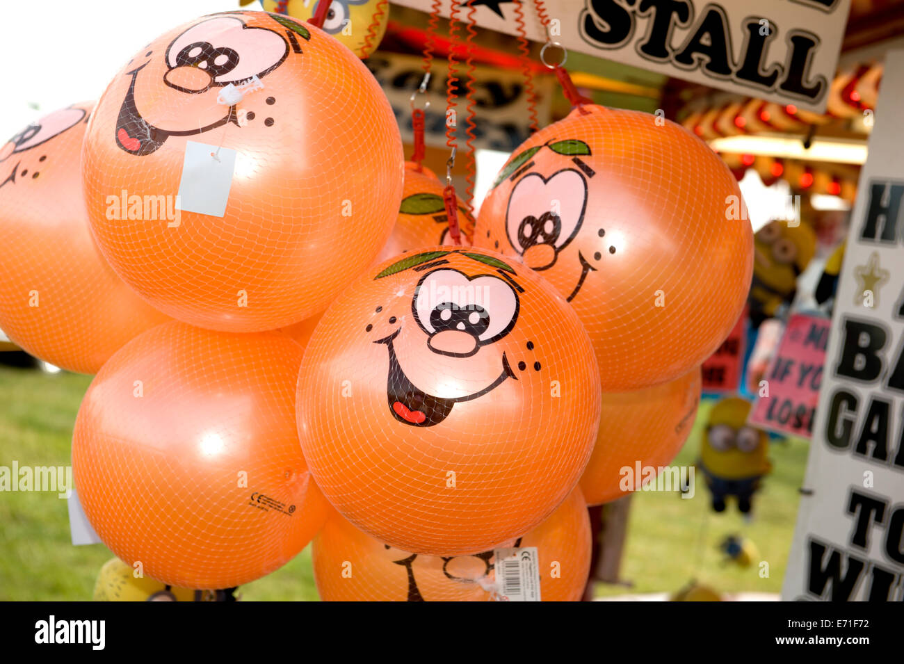 A colourful display of fun orange balloons at the fun fair at the ...