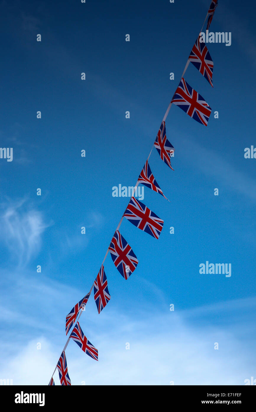 Row of Union Jack Flags against a blue sky Stock Photo - Alamy