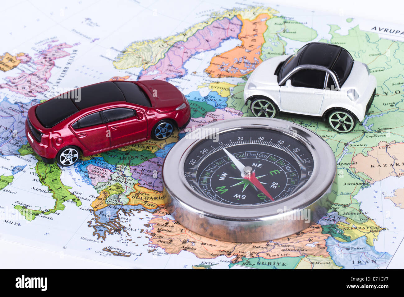 Travel concept, compass and small, toy car map, isolated on white ...