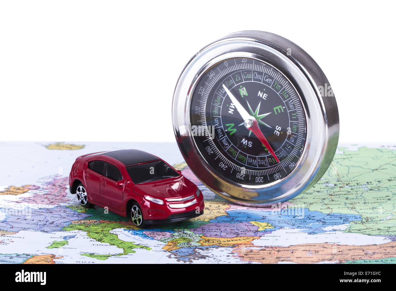 Travel concept, compass and small, toy car map, isolated on white ...