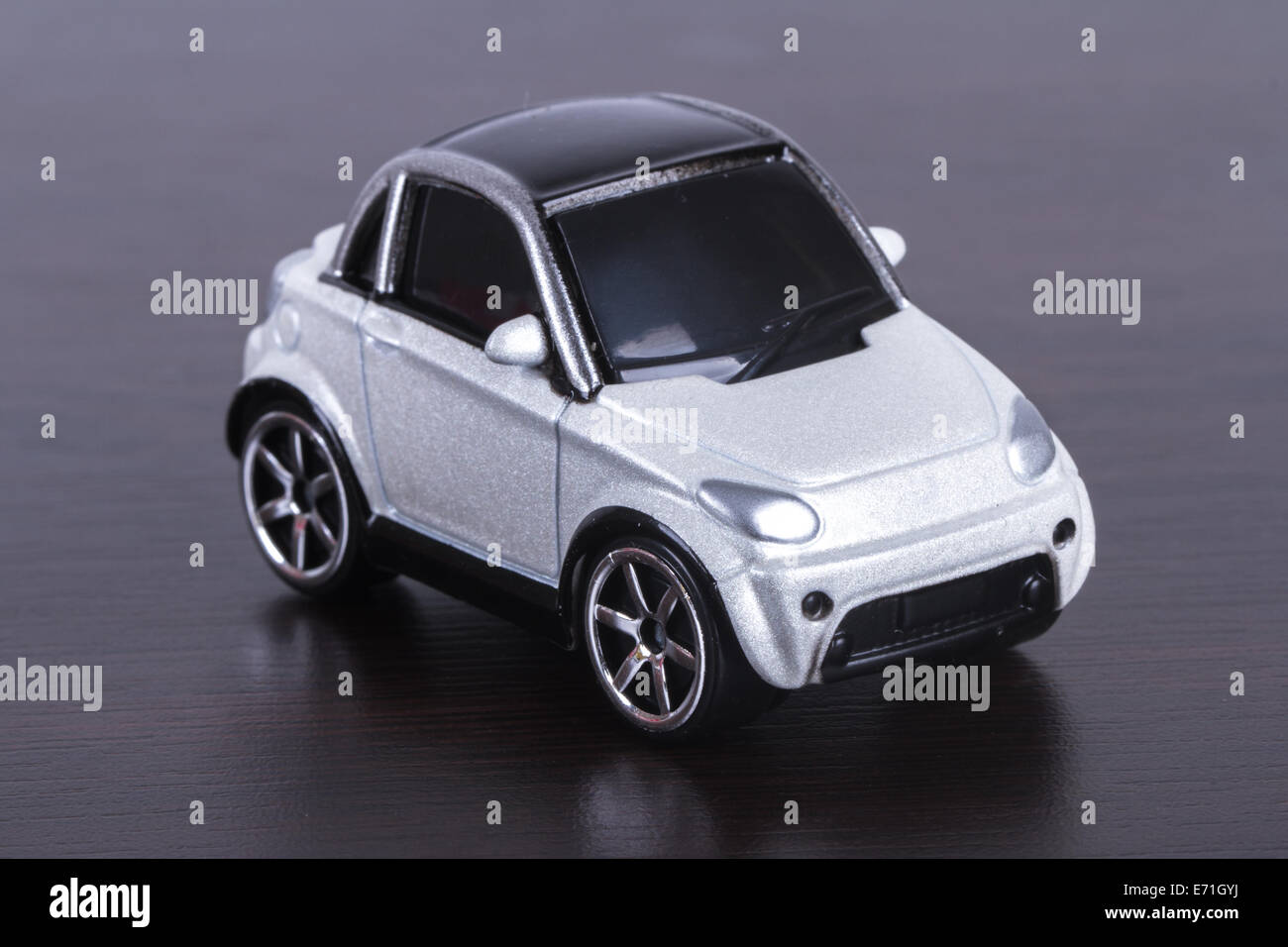 Side view of white, toy, small car on wooden table Stock Photo - Alamy