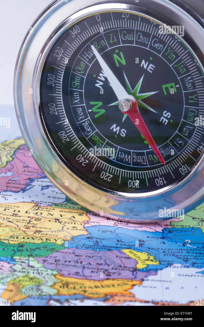 Compass on colorful map for your route Stock Photo - Alamy
