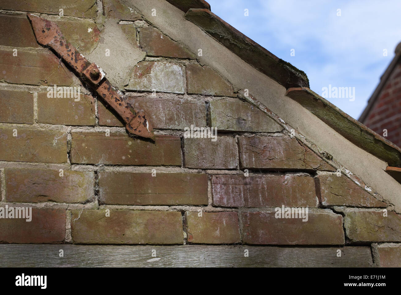 Outbuilding of a country cottage. Norfolk. Long and short brick work ...