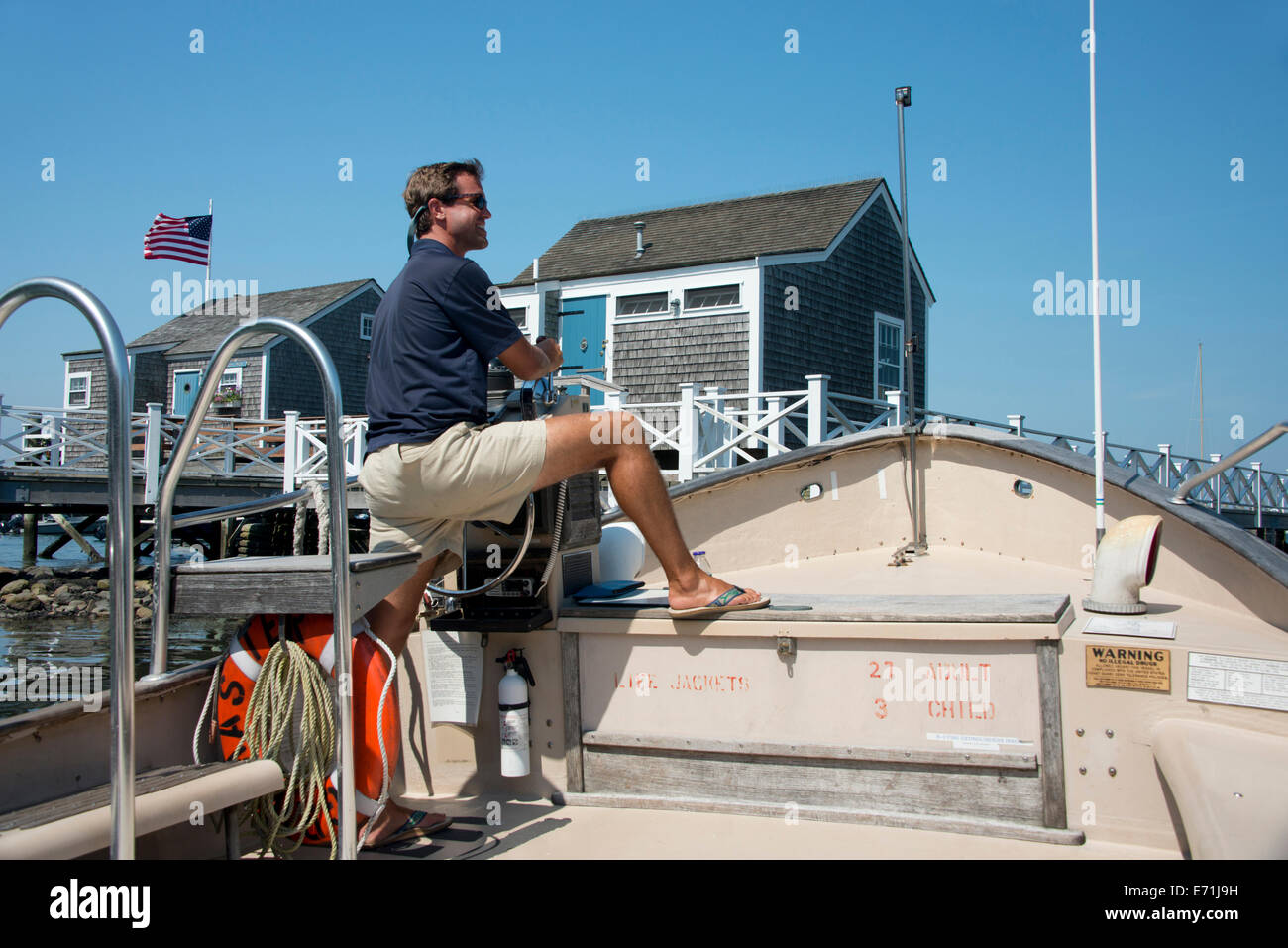 USA, Massachusetts, Nantucket, Straight Wharf. Harbor water taxi in ...