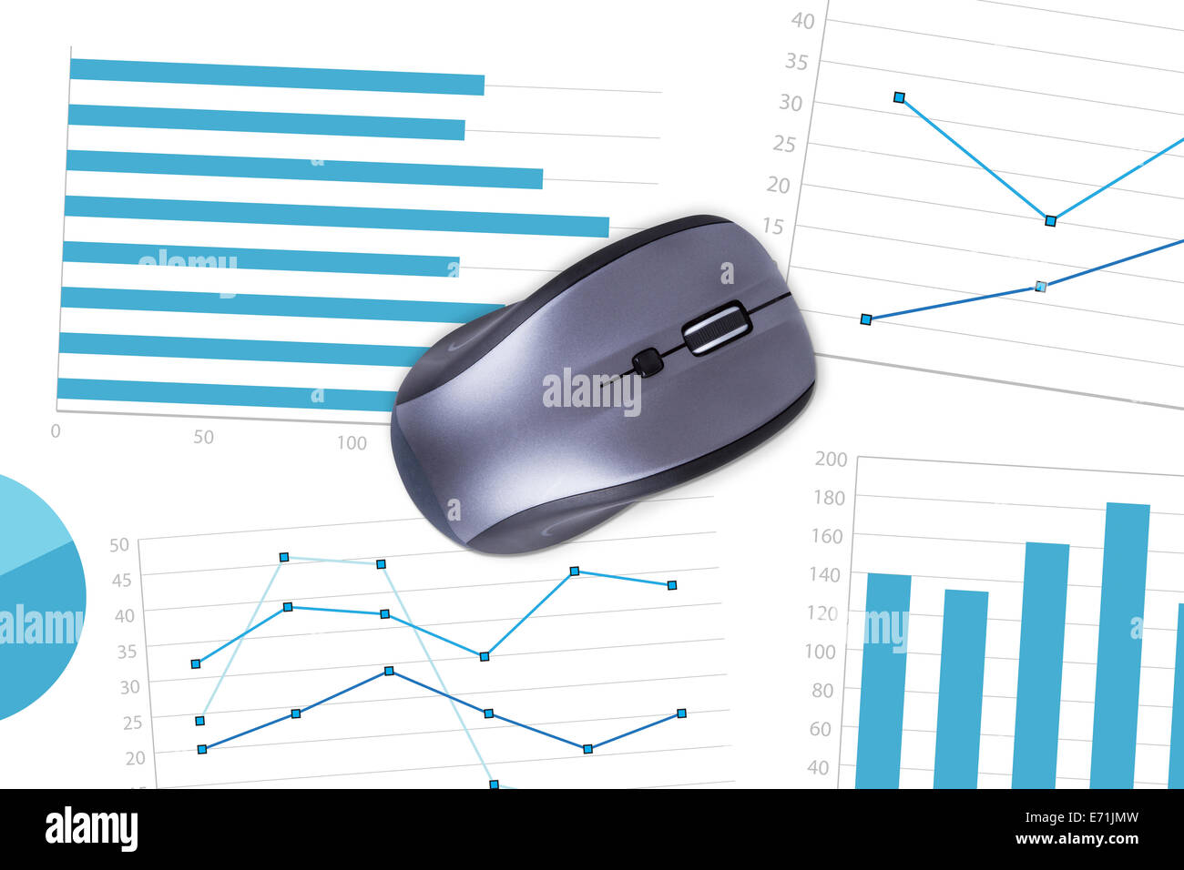 Top view of wireless computer mouse on paper sheet with financial ...
