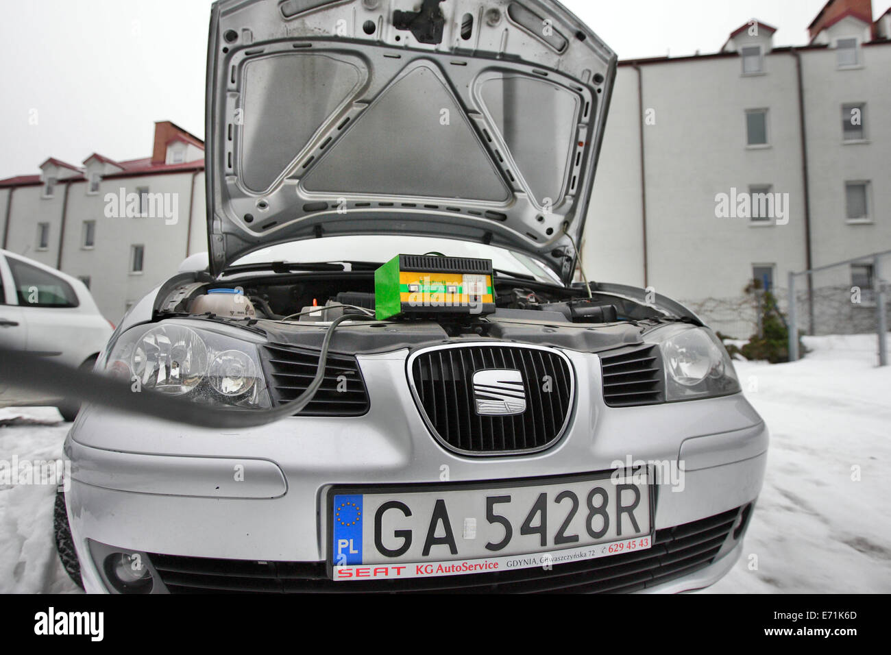 Charging car battery by the rectifier in the silver Seat Cordoba Stock ...