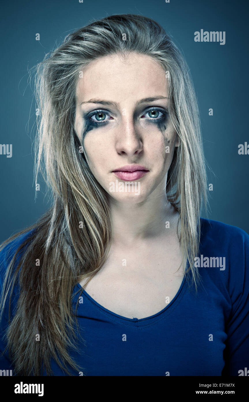 Beautiful young woman crying, with smudged make up Stock Photo - Alamy