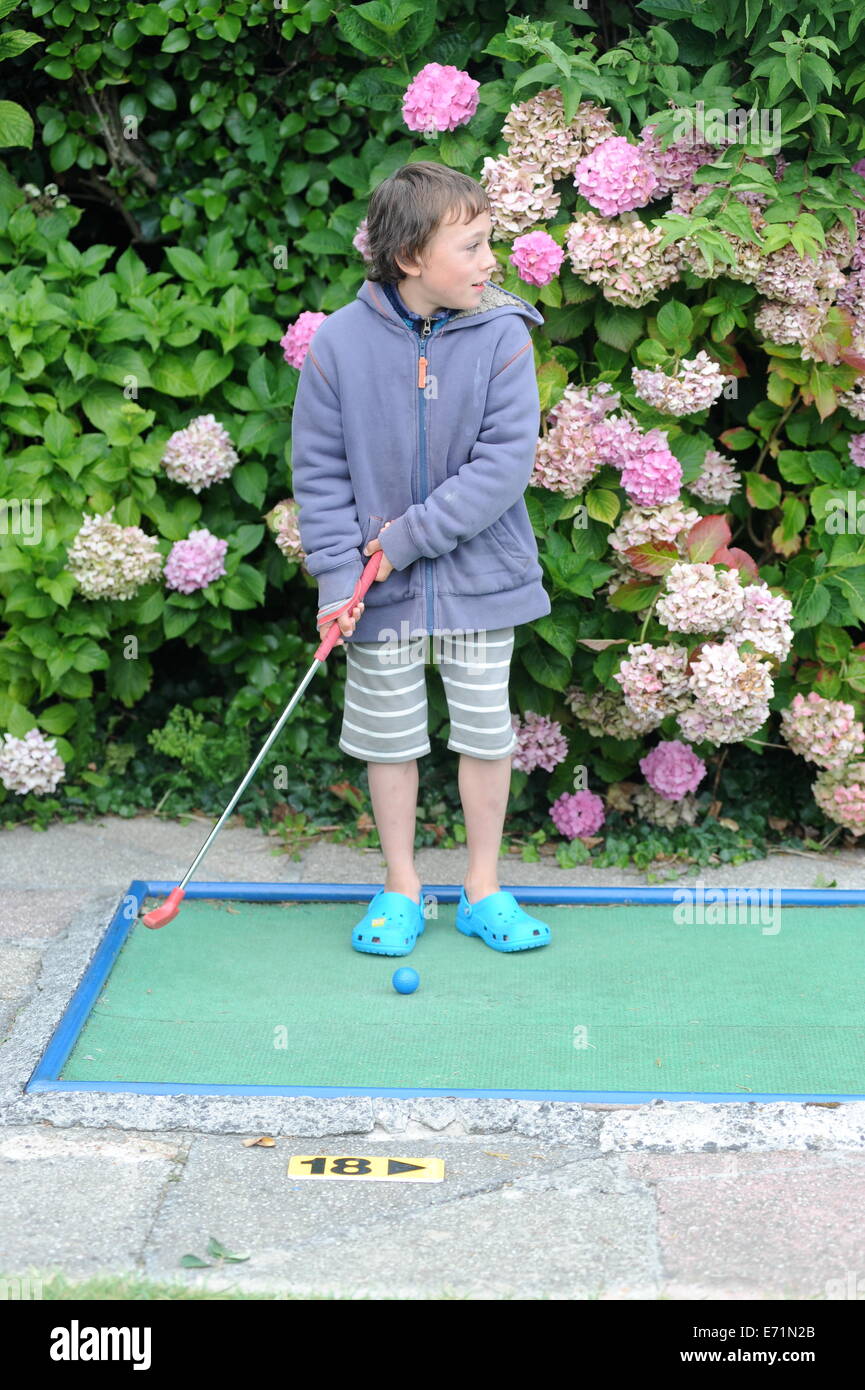 English children playing crazy golf in Newquay, Cornwall, Uk Stock ...