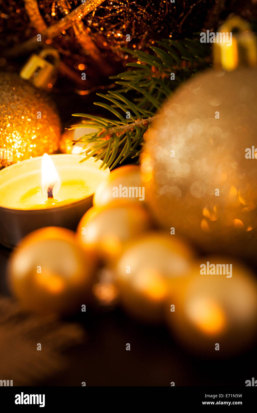 Warm gold and red Christmas candlelight background with burning tea ...