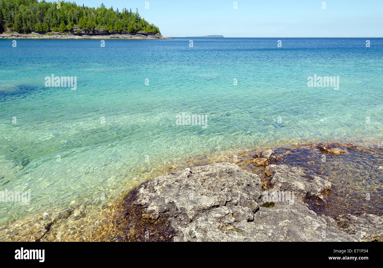Green and blue water of Huron Lake, Canada under blue sky Stock Photo ...