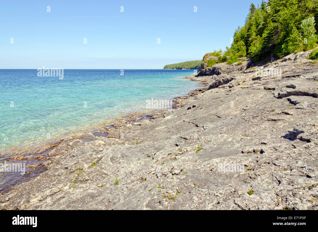 Green and blue water of Huron Lake, Ontario under blue sky Stock Photo ...