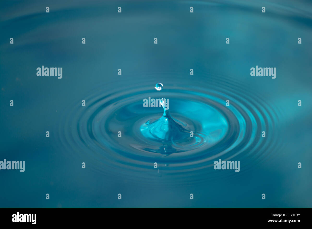 Water Drop on Calm Surface Stock Photo - Alamy
