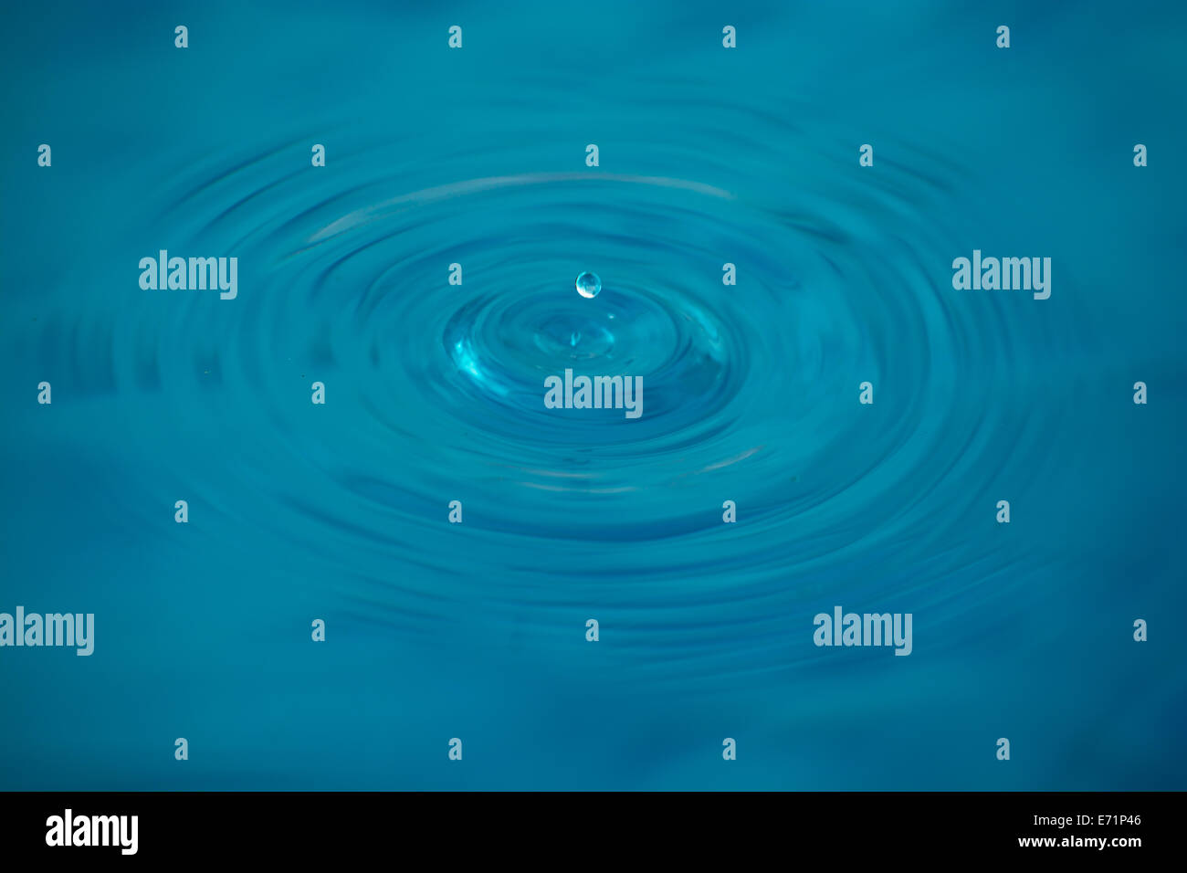 Water Drop on Calm Surface Stock Photo - Alamy
