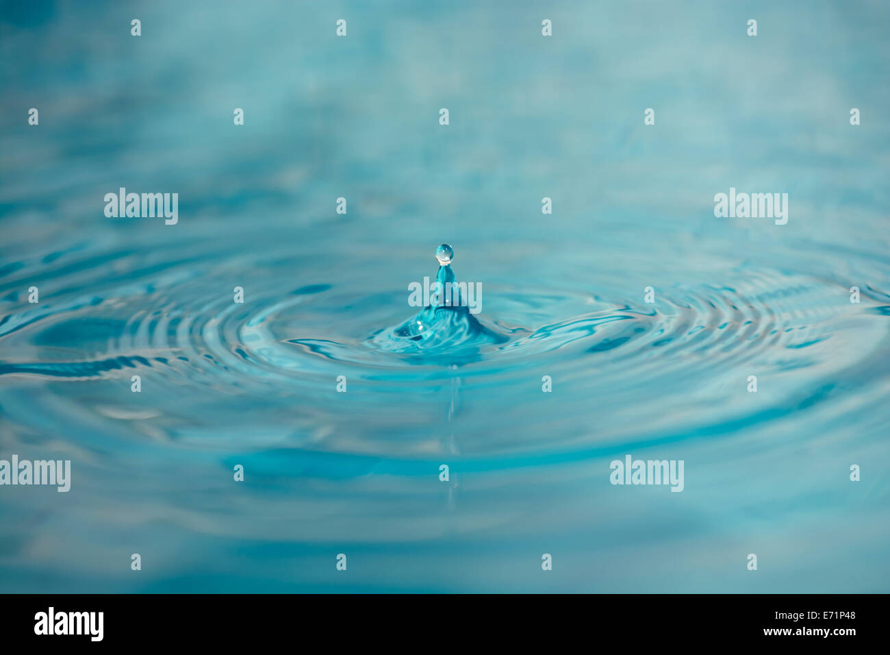 Water Drop on Calm Surface Stock Photo - Alamy