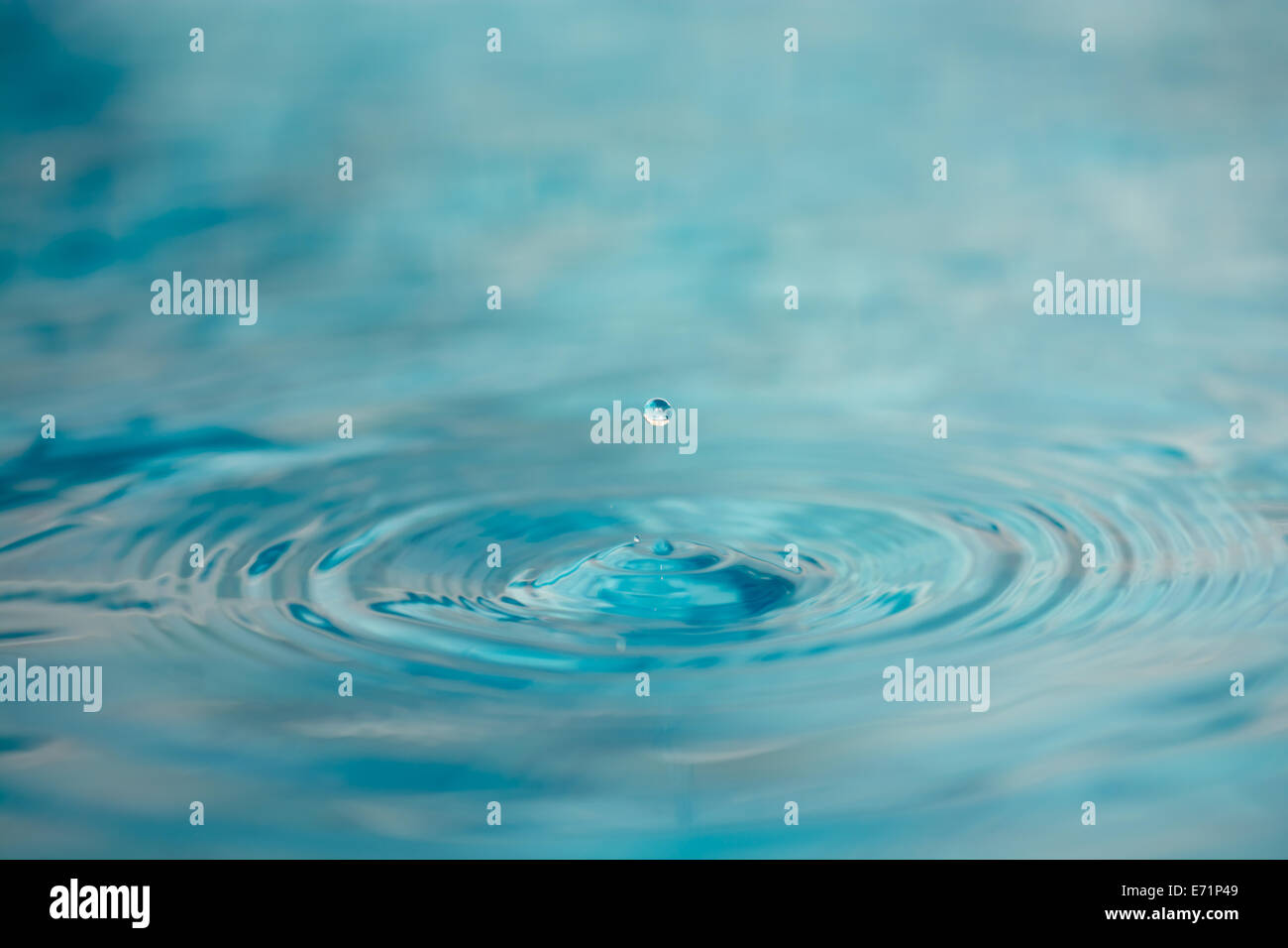 Water Drop on Calm Surface Stock Photo - Alamy