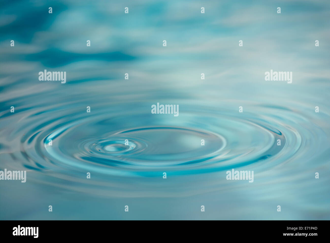 Water Drop on Calm Surface Stock Photo - Alamy
