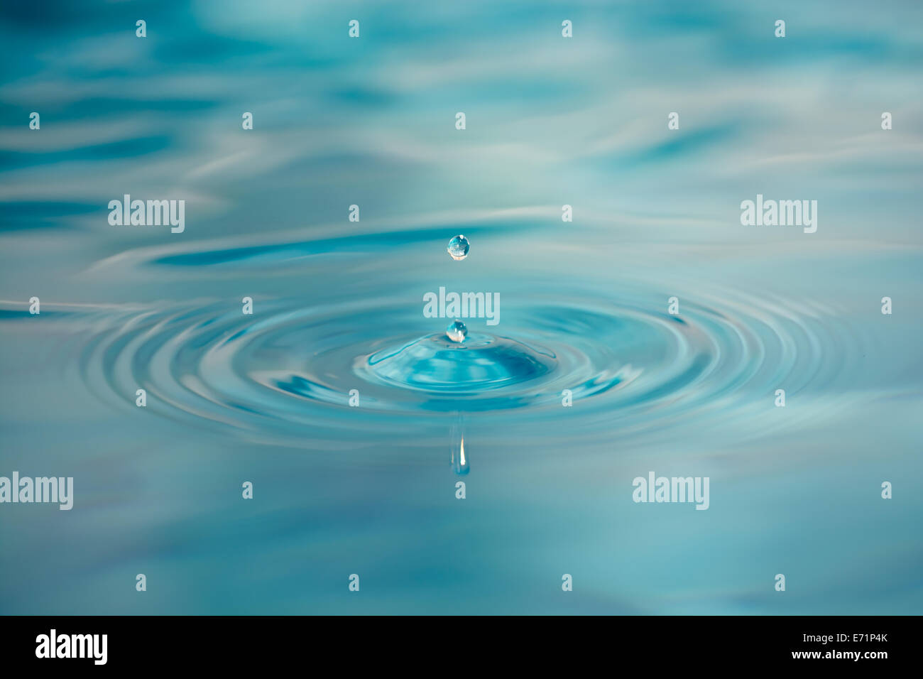 Water Drop on Calm Surface Stock Photo - Alamy