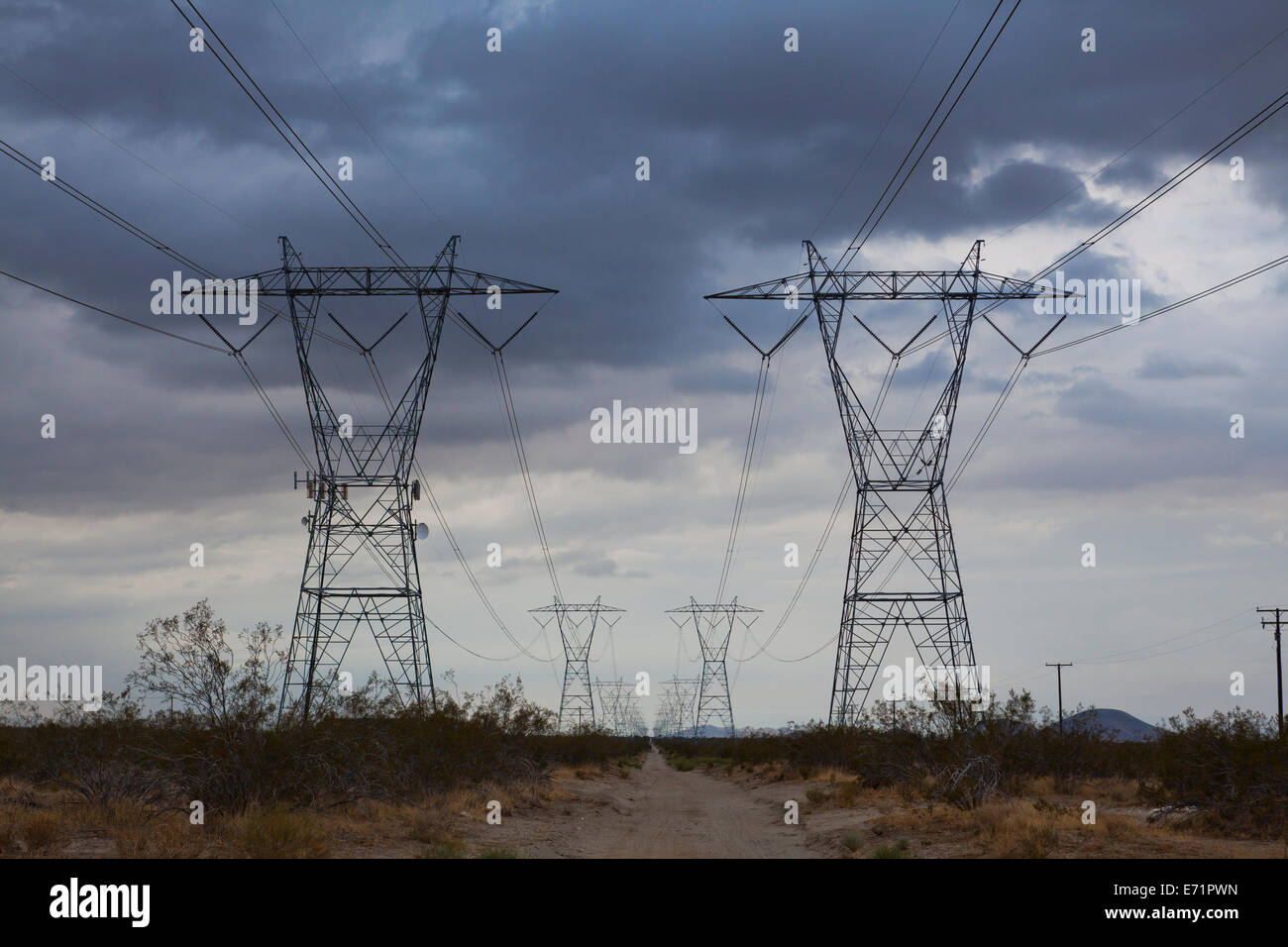 Storm clouds rolling in on the Mojave desert landscape with electricity ...