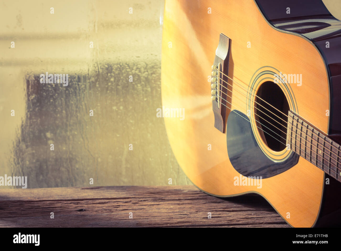 Acoustic guitar next the window with drop water Stock Photo - Alamy