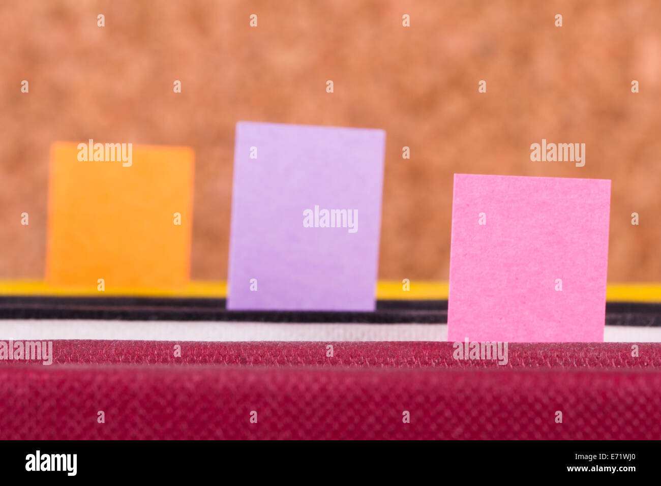 Colorful post it tag markers inside books Stock Photo - Alamy