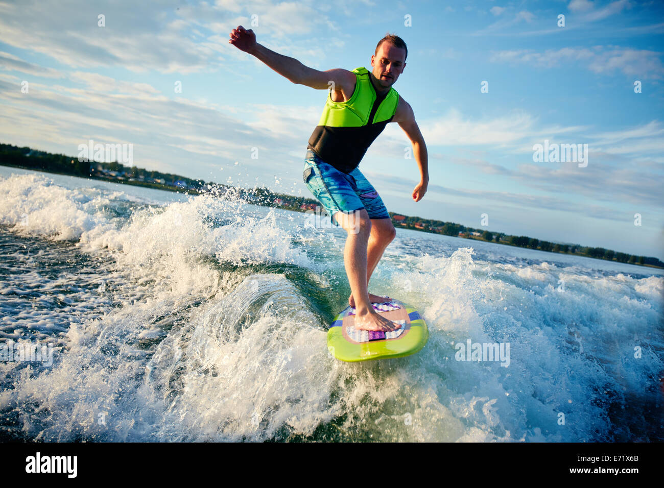 Young man surfboarding in the sea Stock Photo - Alamy