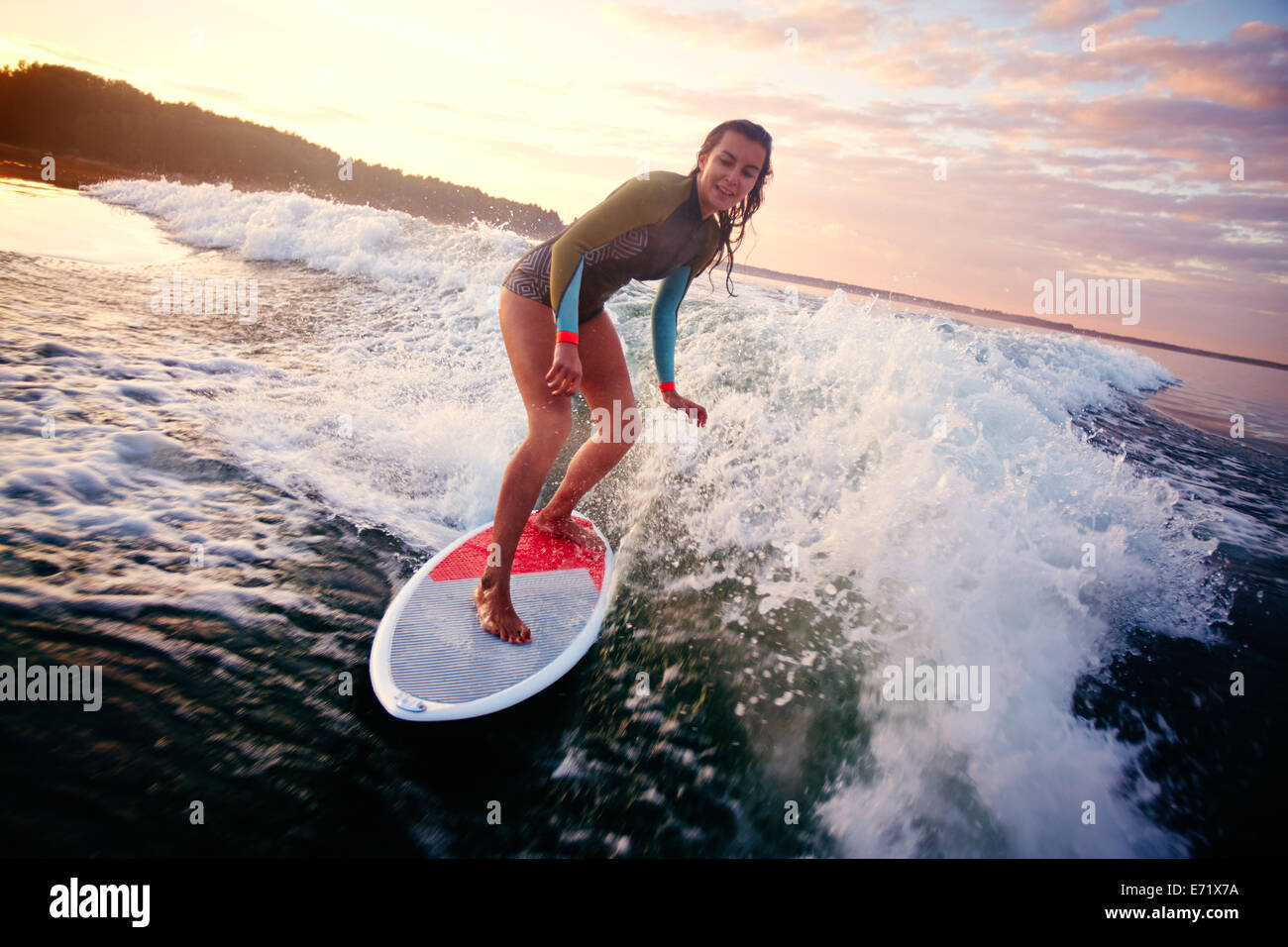 Pretty female enjoying surfing on summer vacation Stock Photo - Alamy