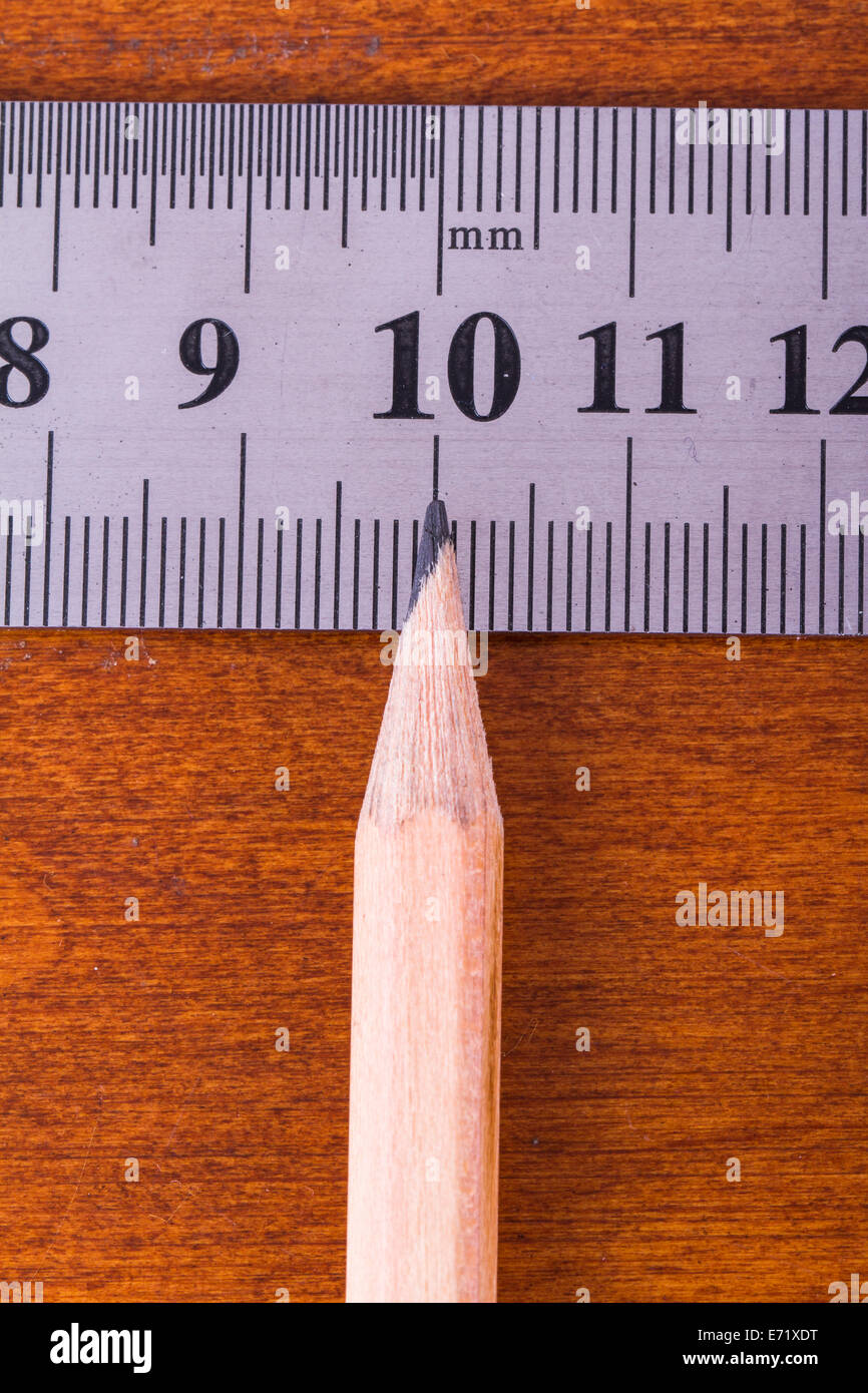 Close up view of wood pencil and steel ruler for engineering drawing on ...