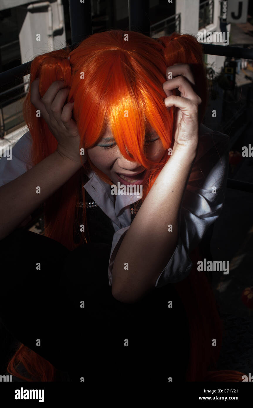 girl with orange wig screaming Stock Photo - Alamy