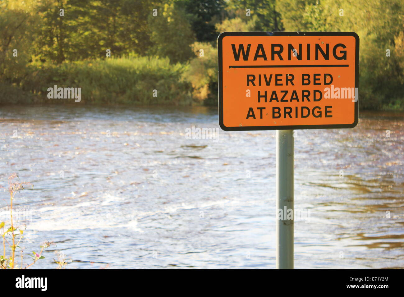 Orange Warning River Bed Hazard at Bridge Sign Stock Photo - Alamy