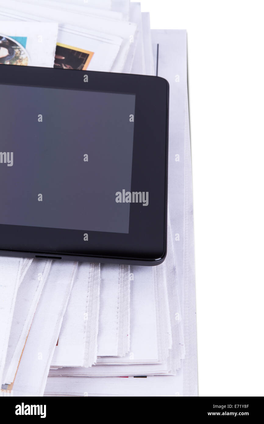 Stack of newspapers and tablet with blank screen, isolated on white ...