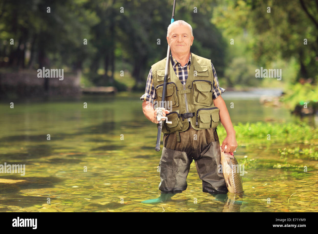 Senior man holding fish hi-res stock photography and images - Alamy
