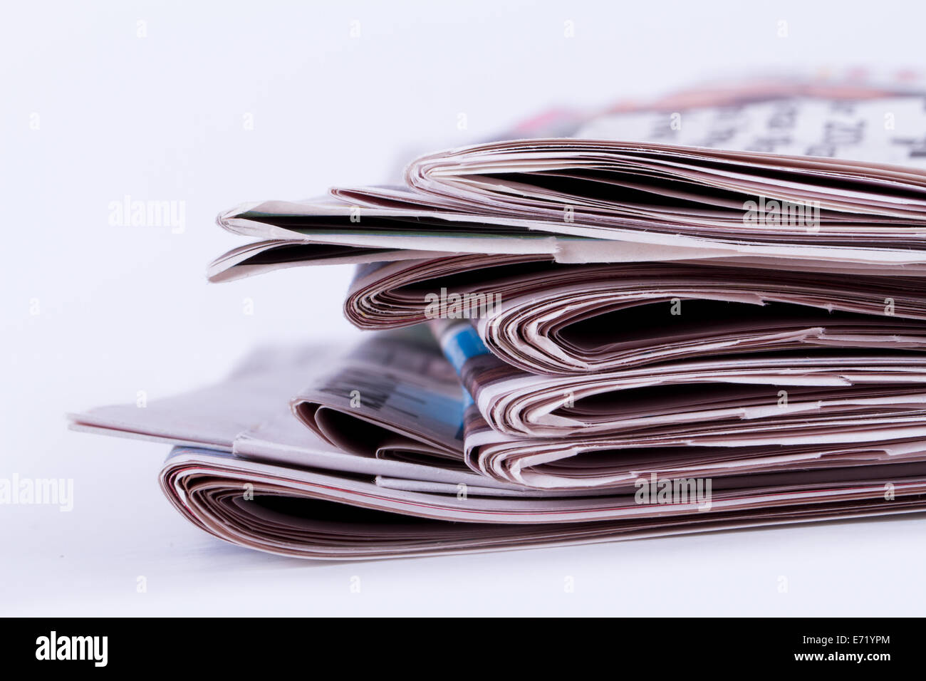 Close up view of stack of newspapers, isolated on white background ...