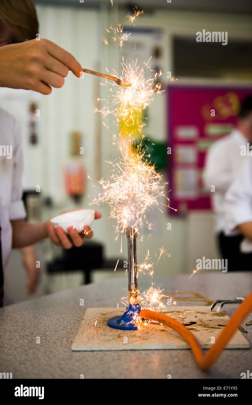 Secondary education Wales UK - a boy doing an experiment in a science ...