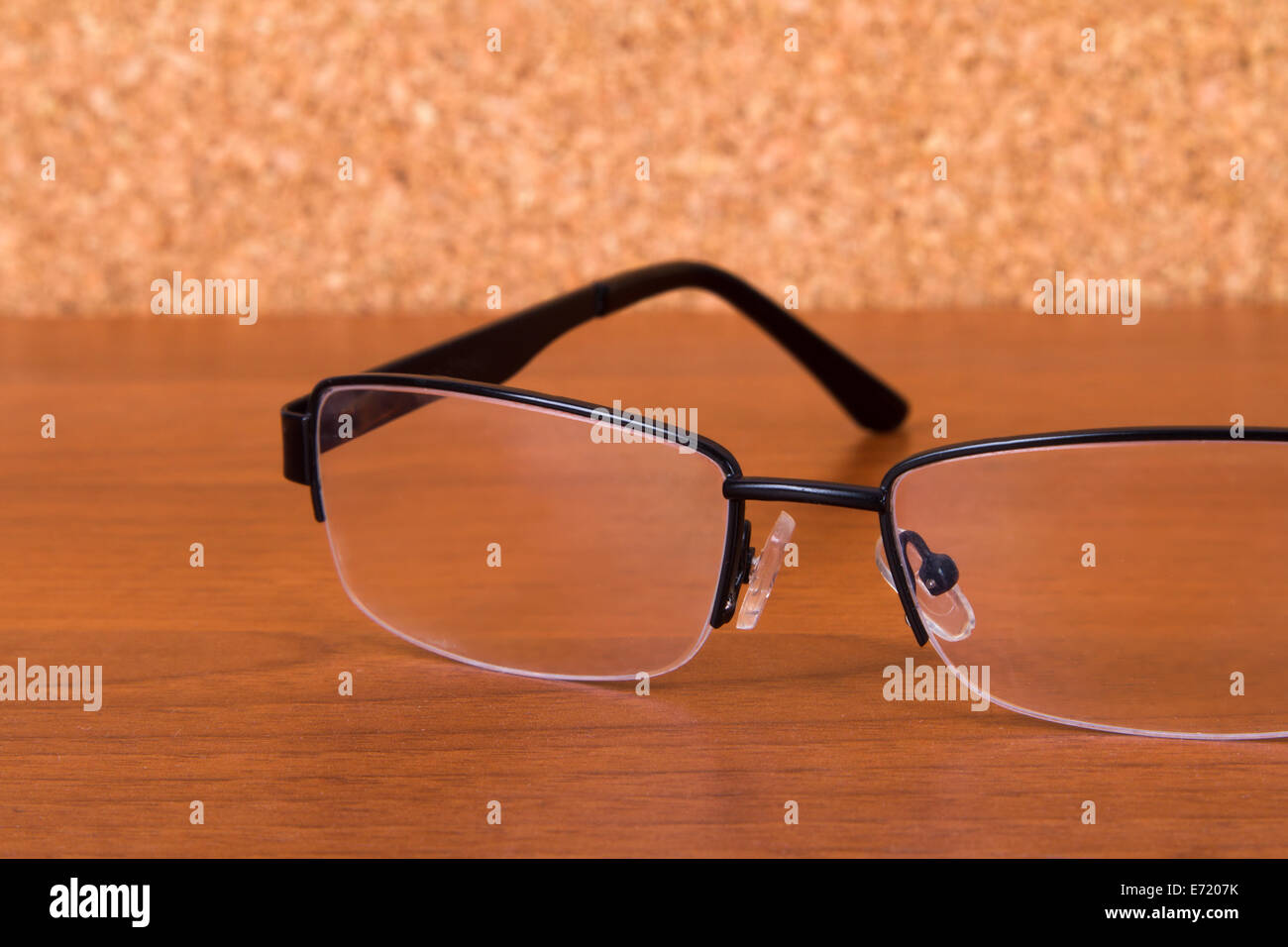 Eyeglasses on wooden table Stock Photo - Alamy