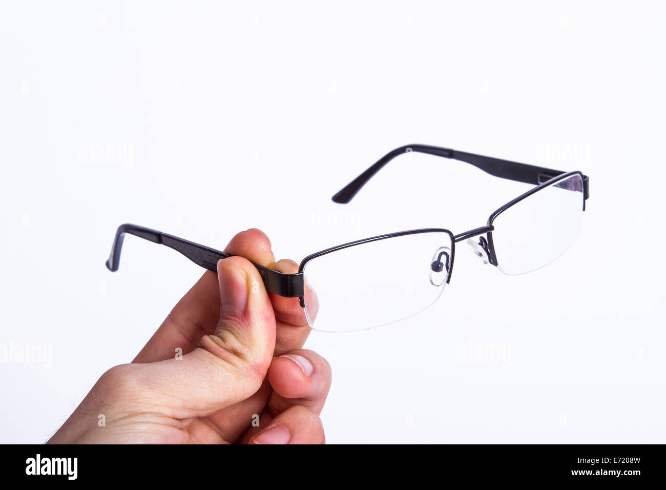 Hand holding pair of eyeglasses, isolated on white background Stock ...
