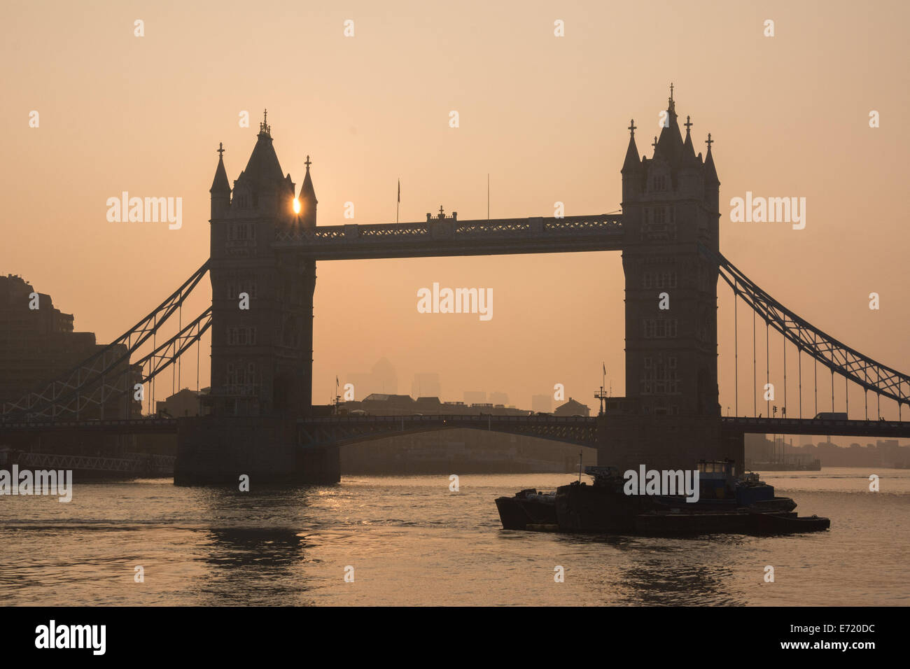 London, UK, 4th September 2014. The rising sun appears to be caught in ...