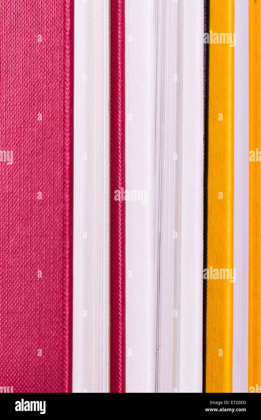 Books in a row as background Stock Photo - Alamy