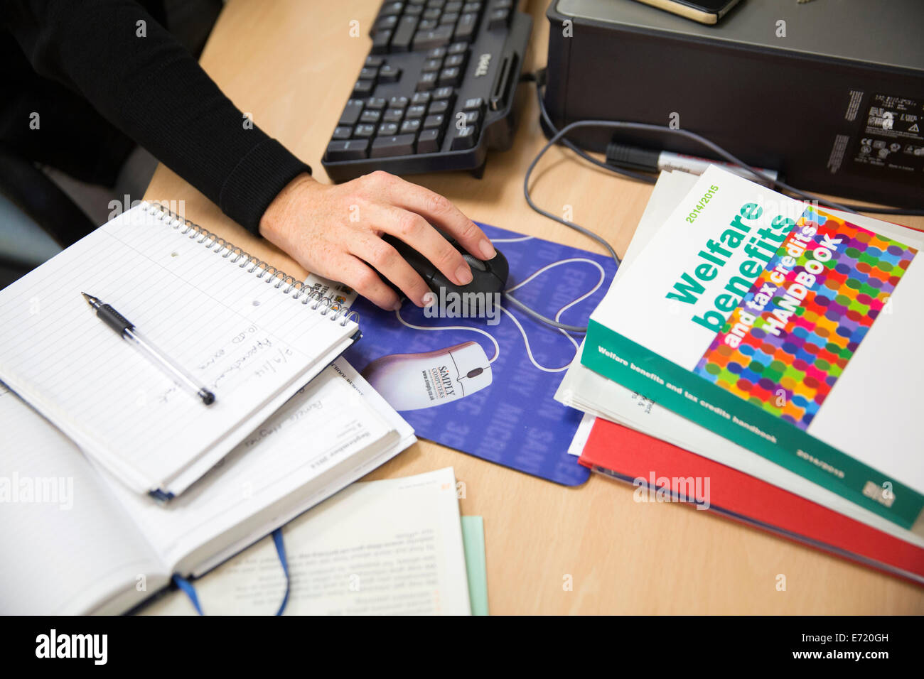 welfare advisor working at computer Stock Photo - Alamy