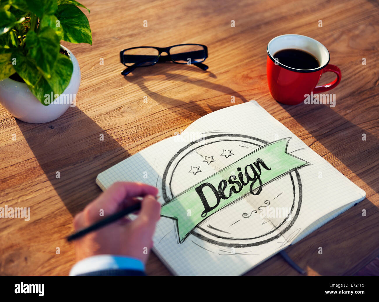 Businessman Writing the Word "Design Stock Photo - Alamy