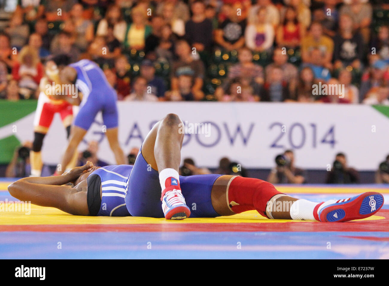 Blandine Metala Epanga of Cameroon (blue) is upset after losing in the ...