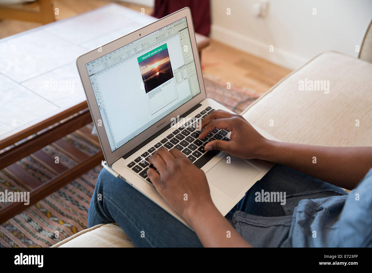 working on apple laptop Stock Photo - Alamy
