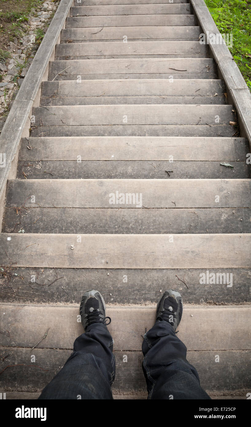 Looking down on a male legs and wooden stairway Stock Photo - Alamy