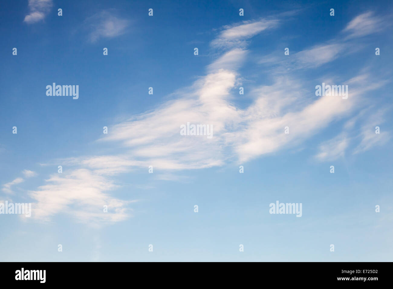 Blue windy cloudy sky background photo texture Stock Photo - Alamy