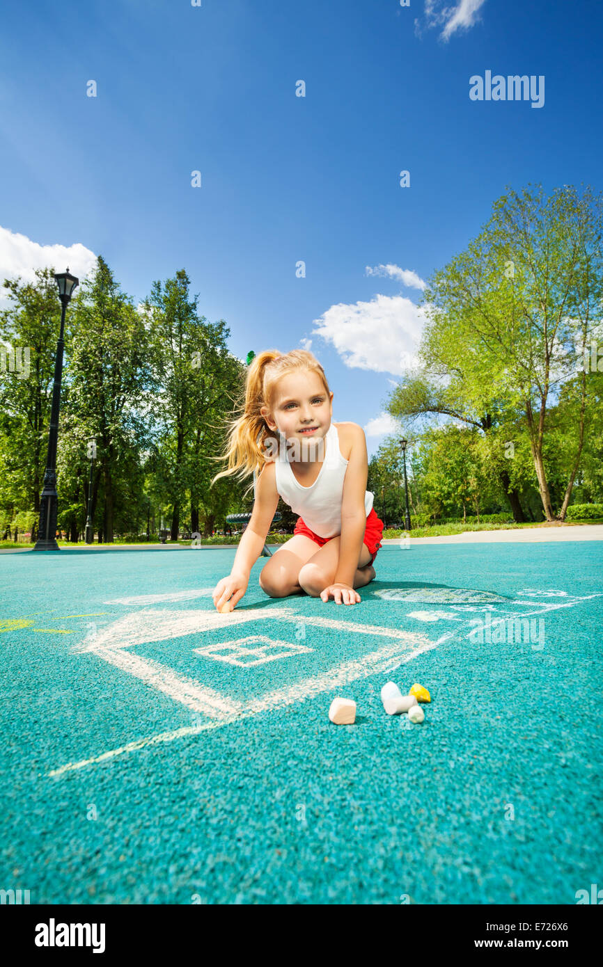 Beautiful Caucasian girl drawing chalk image Stock Photo - Alamy