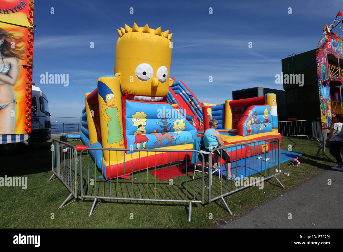 A bart simpson bouncy castle at a funfair Stock Photo - Alamy