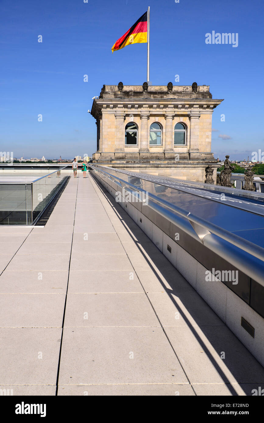 Germany, Berlin, German flag fluttering on a corner tower of the ...